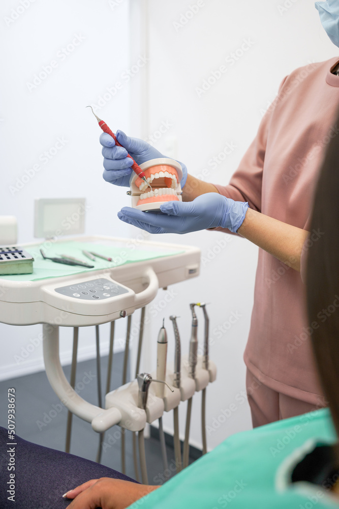 office interior with professional teaching a dental prosthesis, with ...