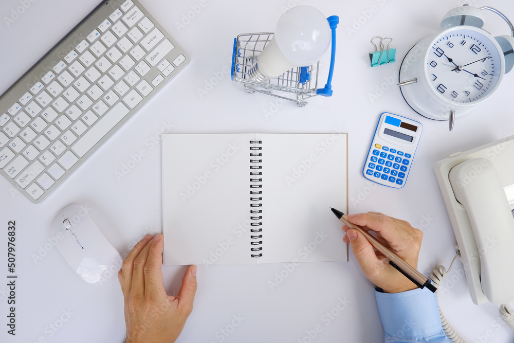 Office desk with smartphone, laptop computer, cup of coffee, and office ...