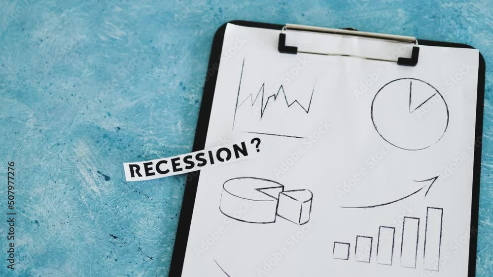 recession text next to clipboard showing a multitude of stas and graphs ...