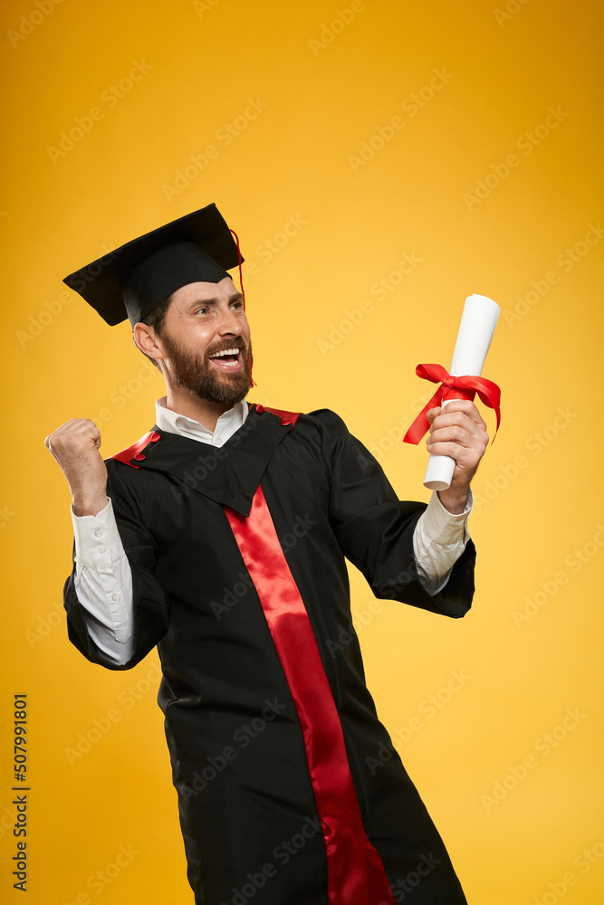 Bachelor, master graduating from university. Handsome boy with beard ...