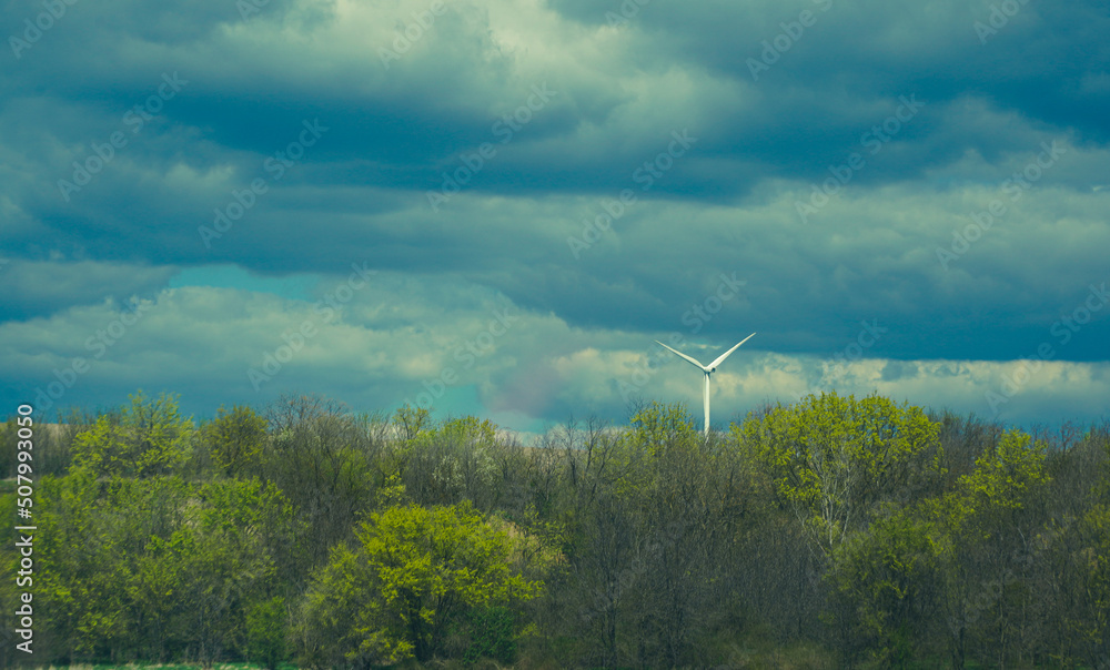 wind turbine. blue background with clouds. photo during the day. Stock ...