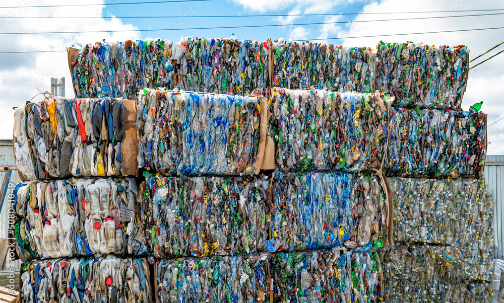 Plastic bottles and Plastic jerry cans in bales ready for recycling ...
