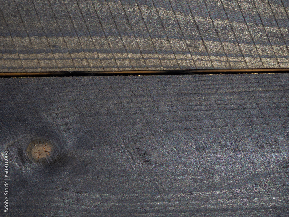 Background from burnt boards. Black wood. Burnt wood wall. Boards after ...