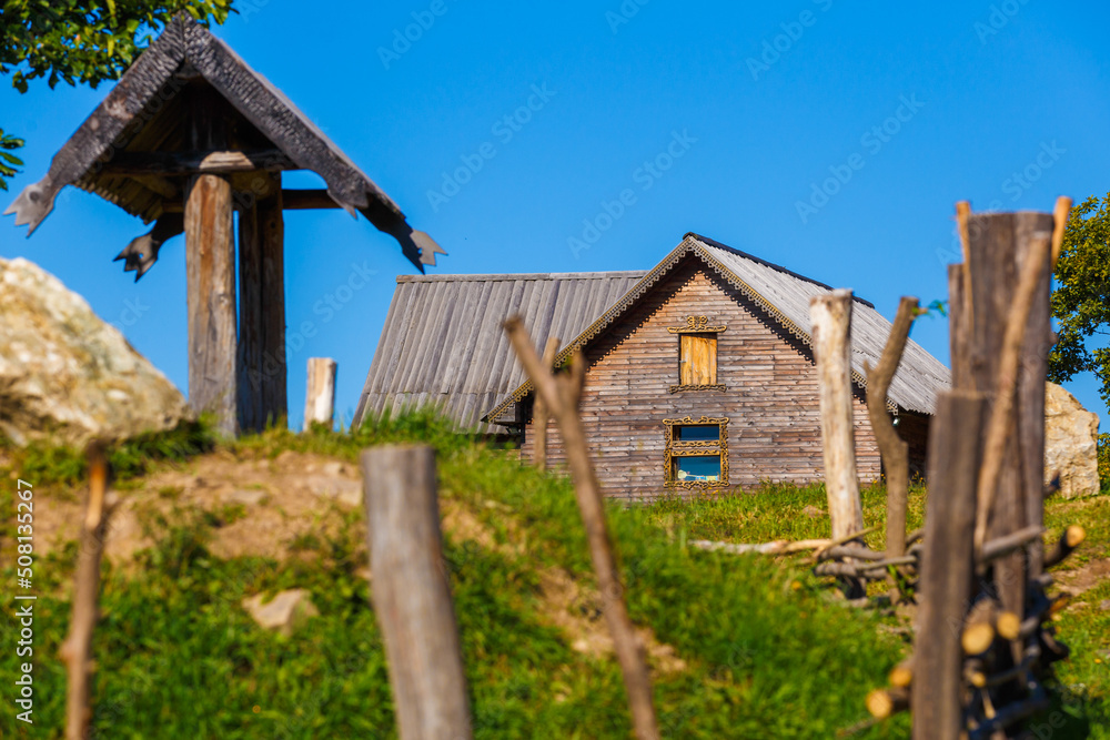 Russian wooden hut against the blue sky. Old village hut. Peasant ...