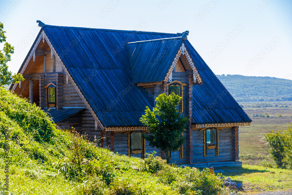 Russian wooden hut against the blue sky. Old village hut. Peasant ...