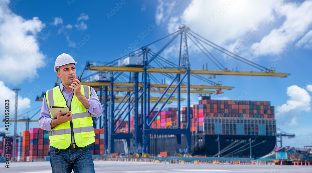 Engineer wearing uniform inspection and detail on tablet with logistics ...