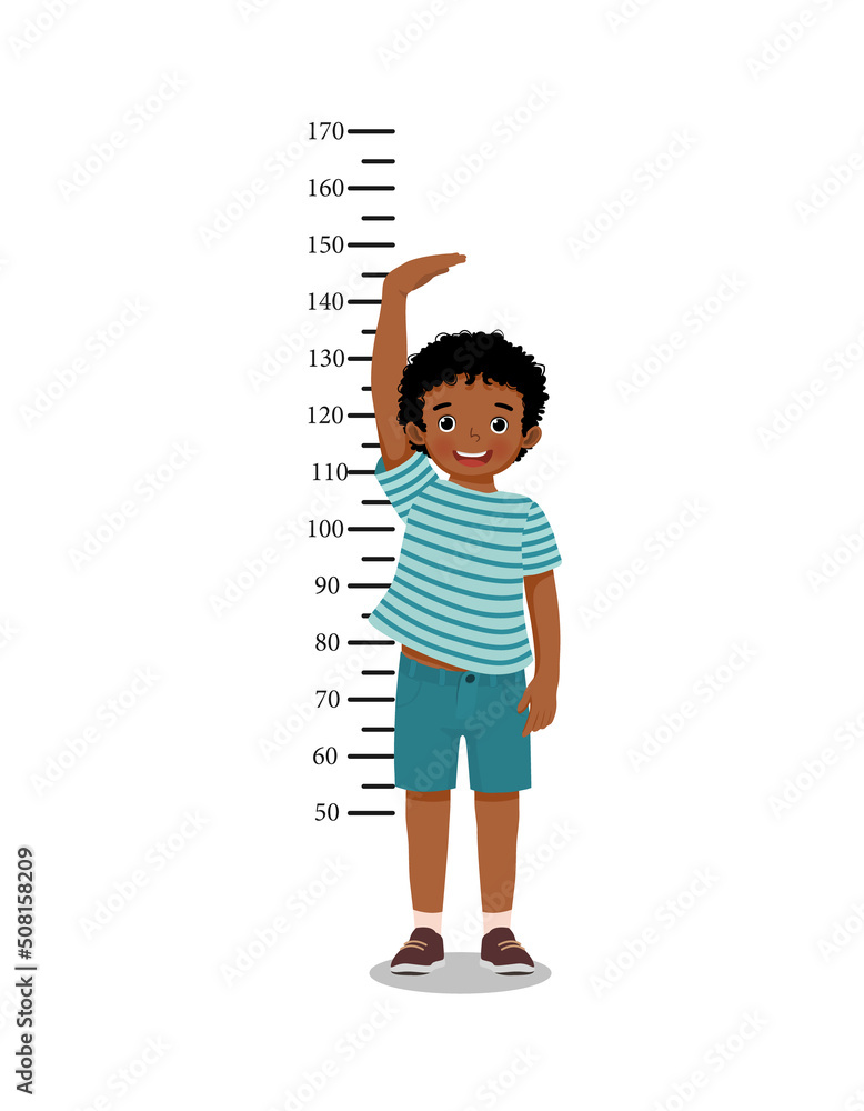 Cute Little African boy measuring height of his growth on the ...