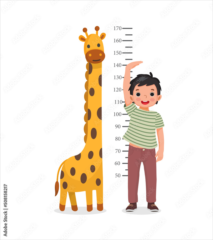 Cute Little boy measuring height of his growth on the background of ...