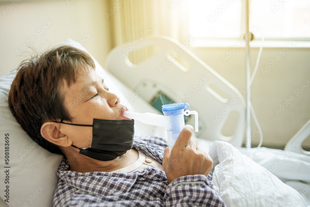 Hospital patient doing nebulization therapy Stock Photo | Adobe Stock