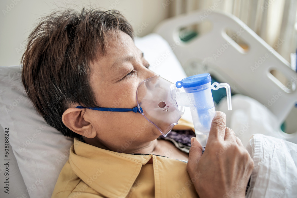 Hospital patient doing nebulization therapy Stock Photo | Adobe Stock