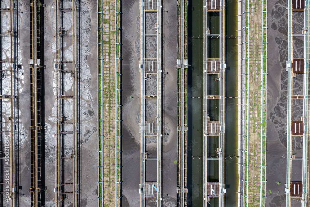 Sewage farm. Aerial photo looking down onto the clarifying tanks and ...