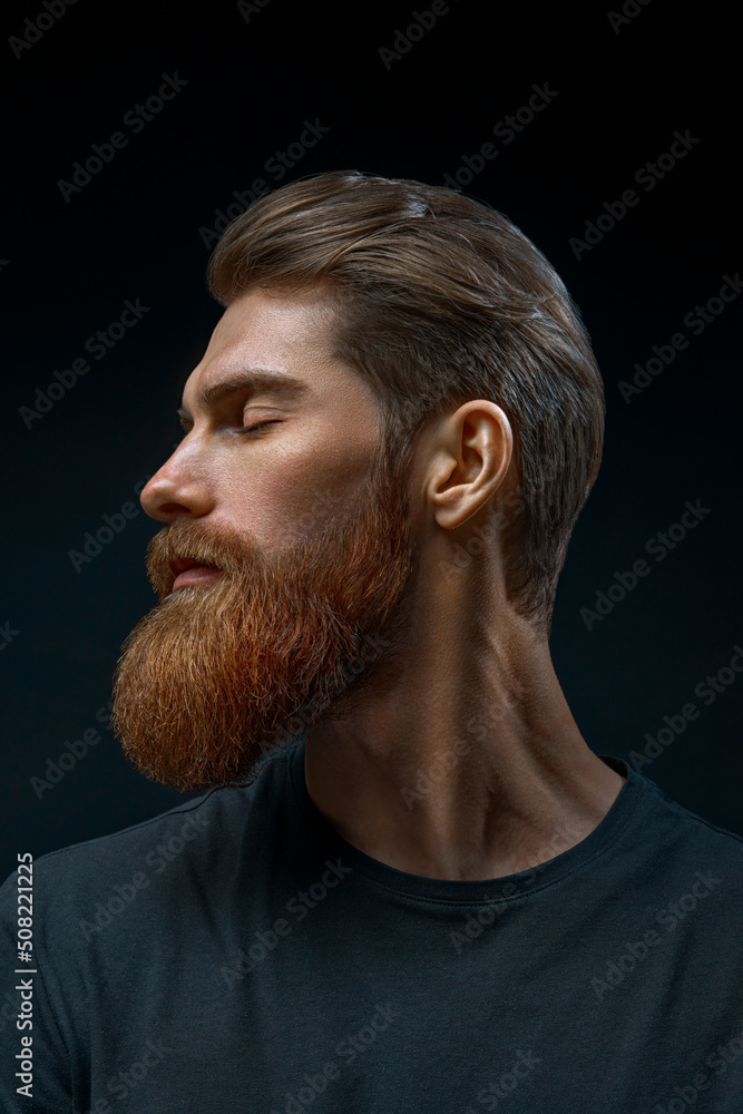 Perfect beard. the young man closed his eyes and turned his head in ...