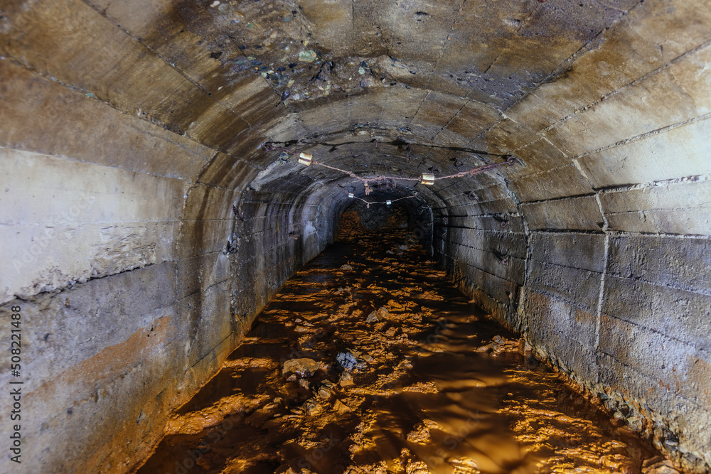 Dark dirty flooded collapsed mine tunnel Stock Photo | Adobe Stock