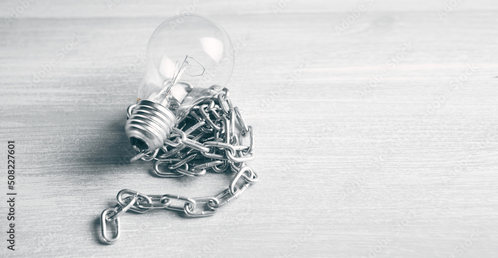 intellectual property. light bulb with chain Stock Photo | Adobe Stock