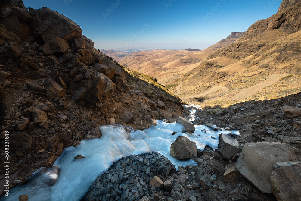 Mountain waterfall frozen at the Sani Pass, Drakensberg Mountains in ...
