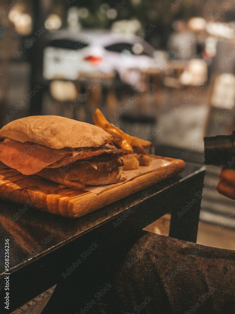 lomito typical dish of Argentina. meat sandwich with ham and cheese ...
