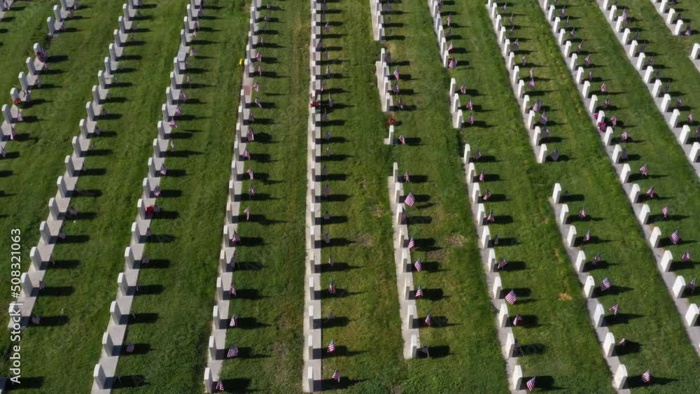 Drone Aerial Above a Military Cemetery Flying own Rows of Headstones ...