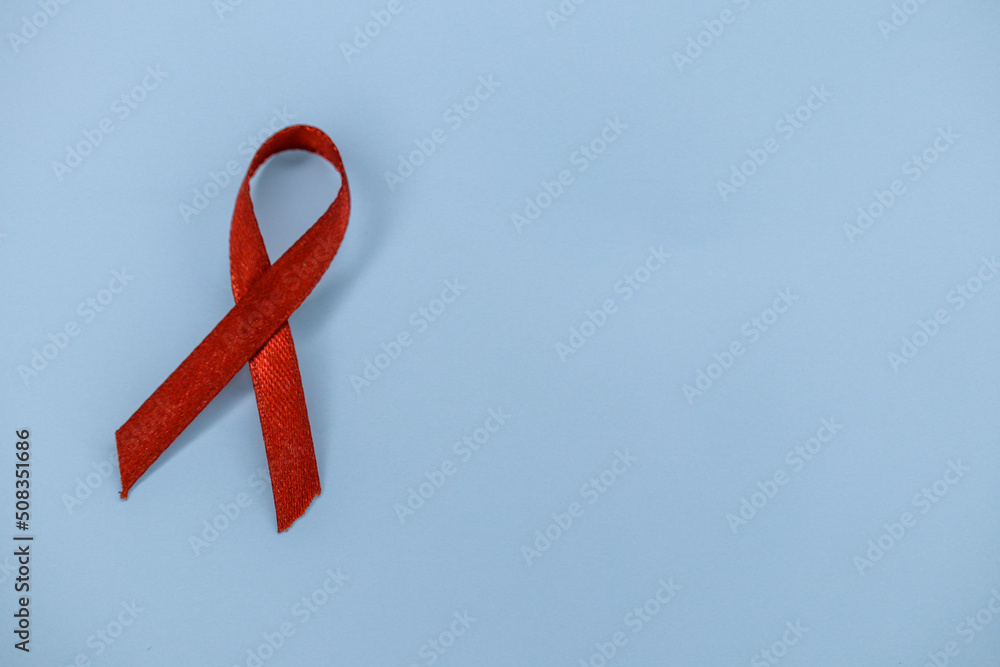 red ribbon concept to celebrate world hiv aids day with pastel light ...