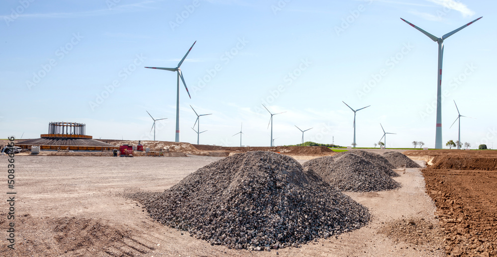 Construction site and agriculture field. Preparation of a wind turbines ...