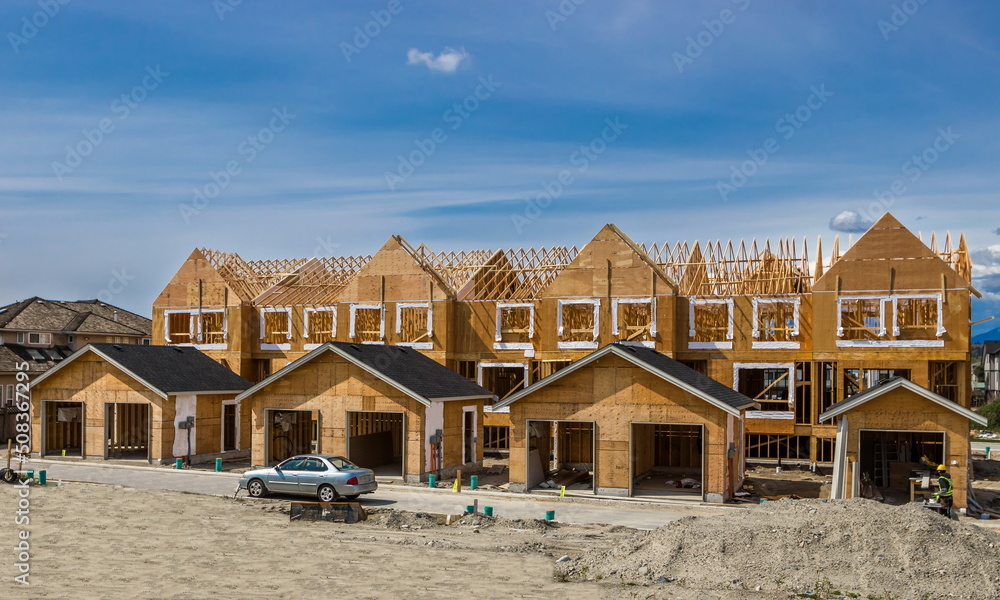 Construction of a new wooden building in a residential area of Richmond ...