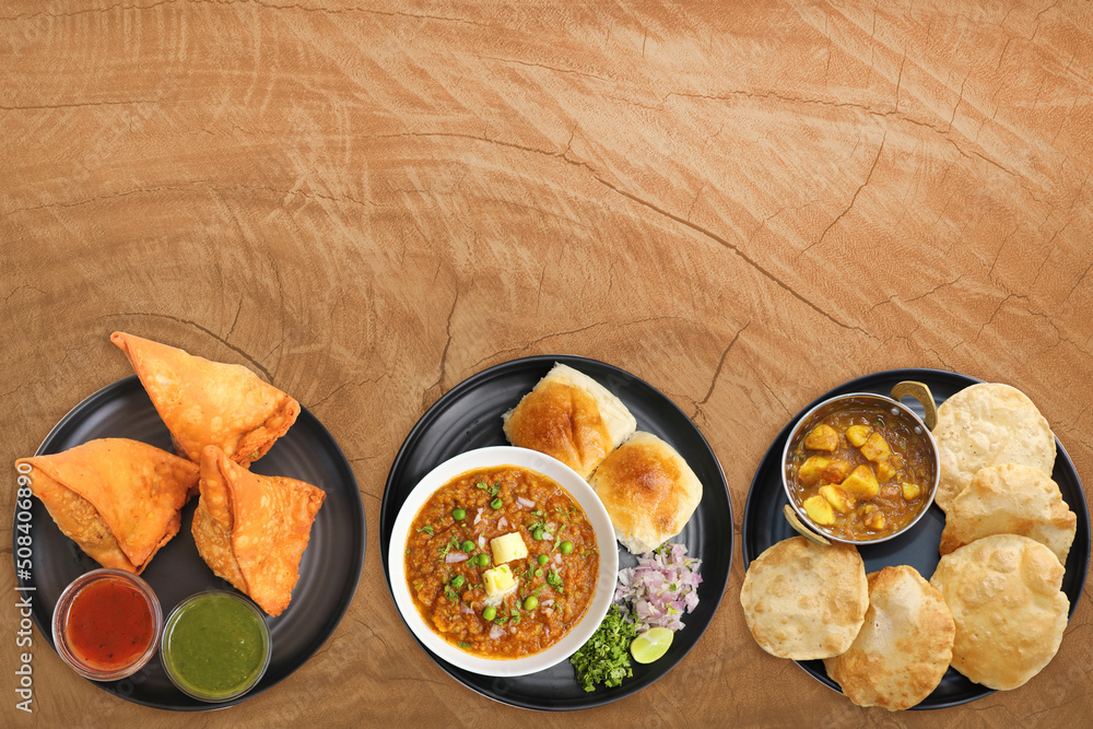 Assorted Indian snack dishes. Samosa, Pav Bhaji, Puri bhaji, Medu vada ...