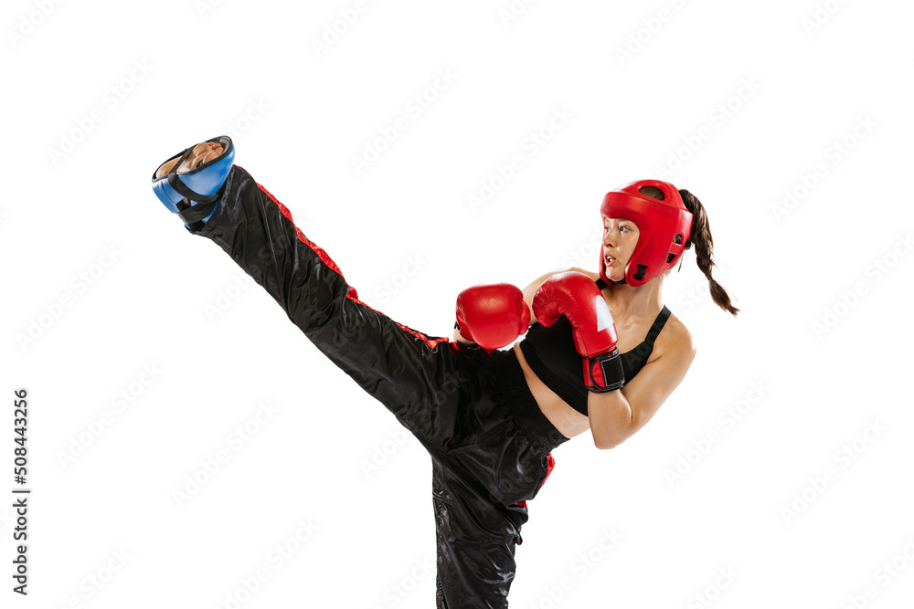 One female boxer in boxing gloves and helmet training isolated on white ...