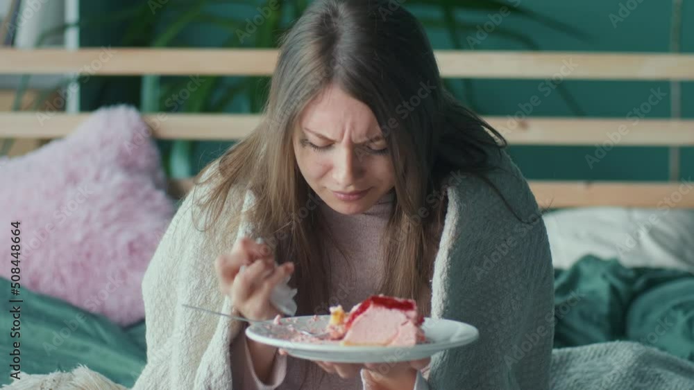 Heartbroken Young Woman Sitting on Sofa, Crying, Eating Cake, Using ...