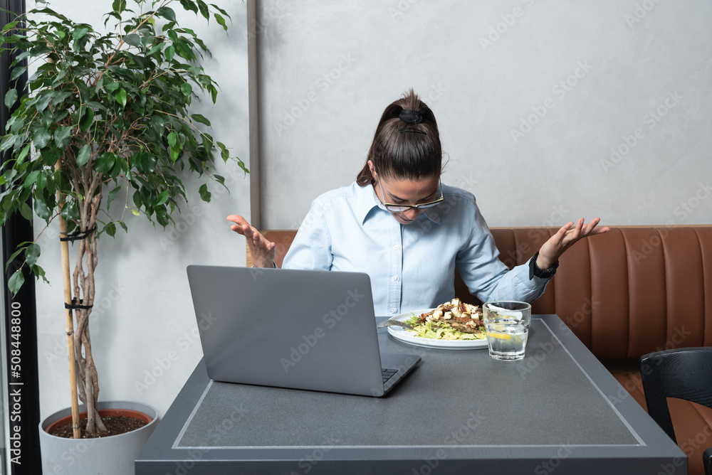 Gorgeous cheerful woman freelancer with good mood and laptop computer ...