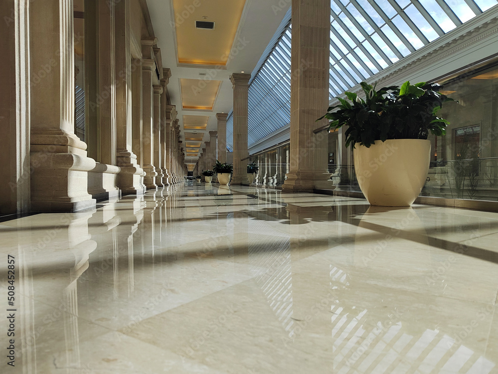 Shining floor marble reflection. empty hall in the modern office ...