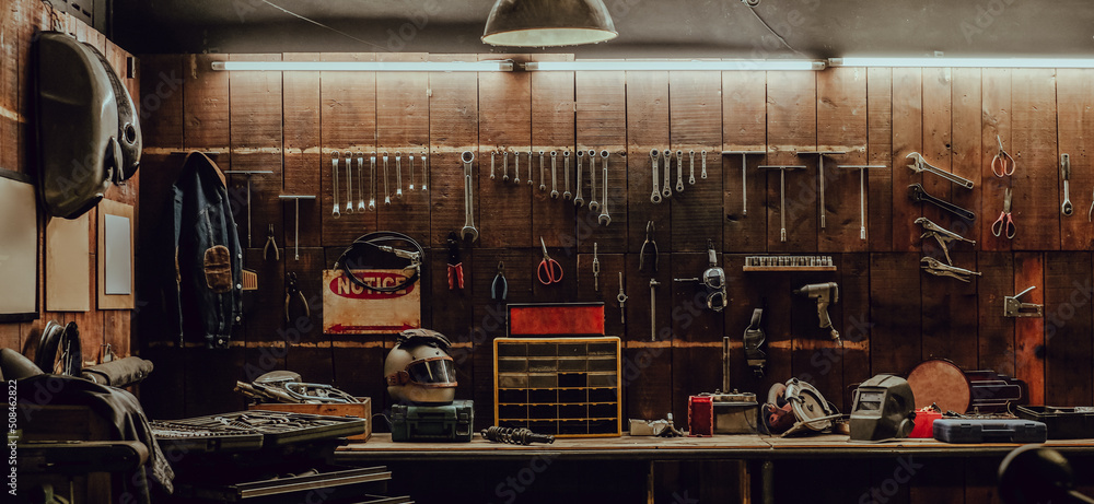 Workshop scene. Old tools hanging on wall in workshop, Tool shelf ...