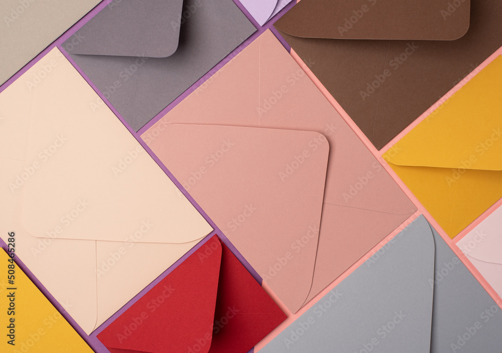 Envelopes of a different size and color on a two-colored background ...