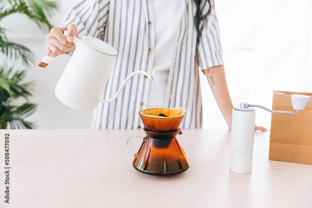 Crop image of professional woman barista with black long hair, hand ...