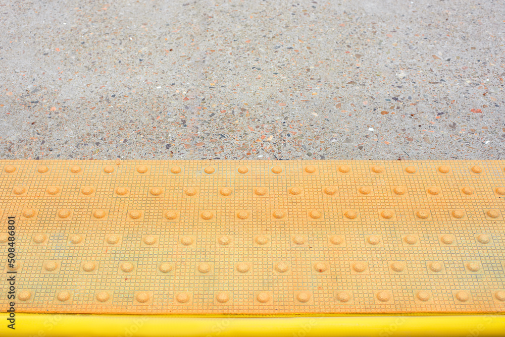 Tactile tiles for the blind. Panels for the blind laid on asphalt ...