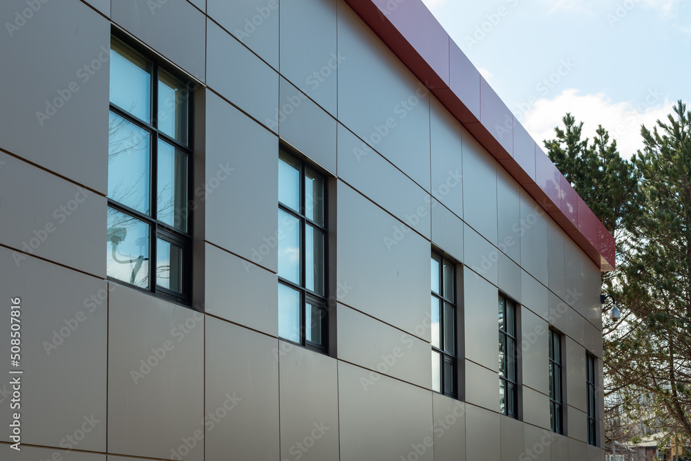 The exterior wall of a contemporary commercial style building with ...