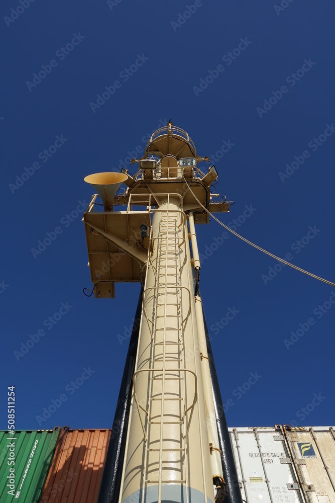 View on forward vessel mast with ladder and foghorn from mooring ...