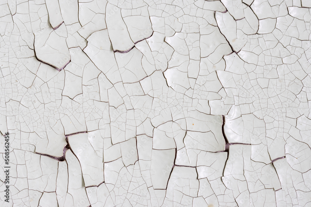 White peeling paint on the wall. Old concrete wall with cracked flaking ...