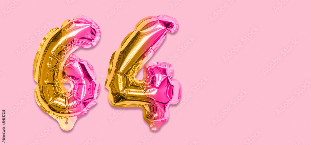 Rainbow foil balloon number, digit sixty four on a pink background ...