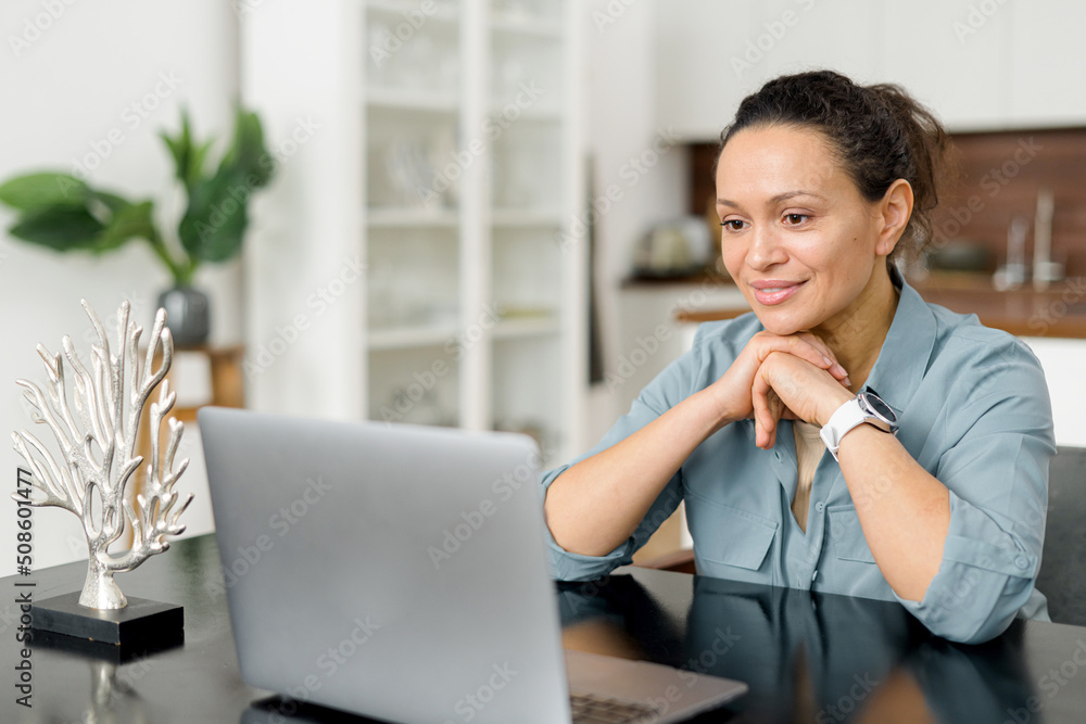 Intelligent businesswoman using a laptop in the office. Smart woman ...