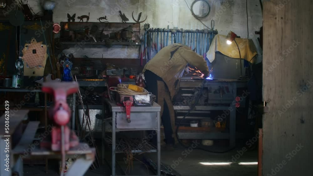A man welds plates for body armor from springs. homemade armor plate ...