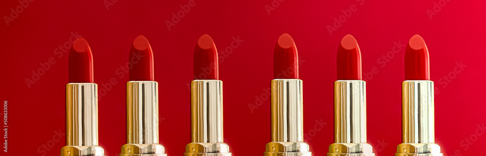 Red Lipstick In Golden Tubes On Colour Background Luxury Make Up And