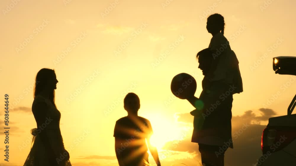 Father mother child play with ball rays sun laugh joyfully. Happy ...
