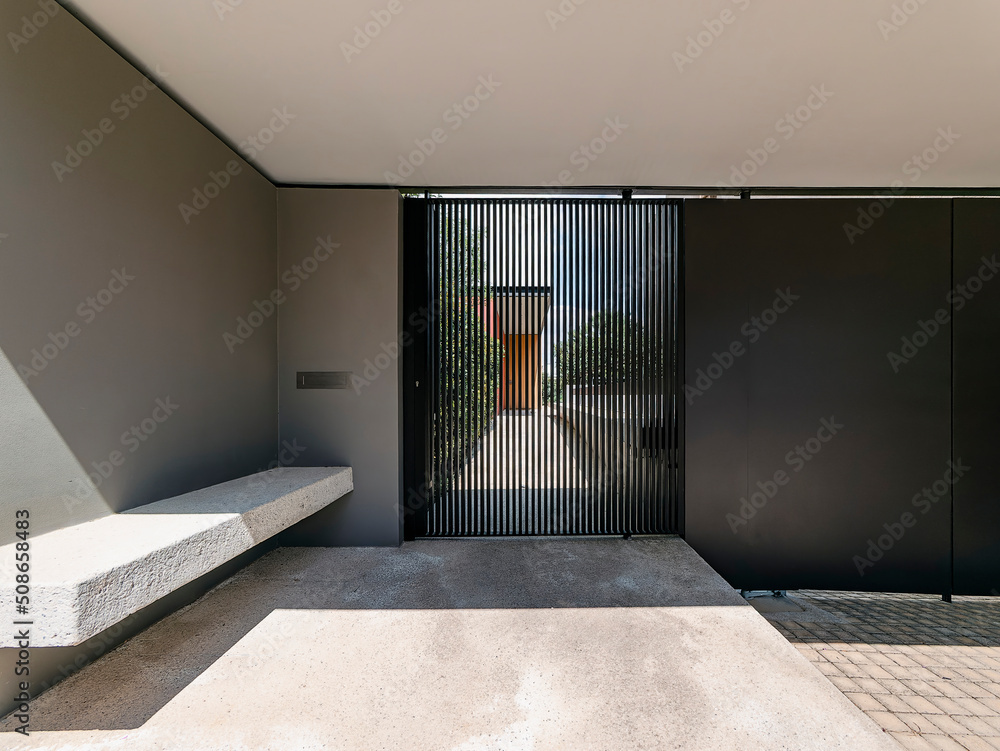 An entrance with a see through door of a modern family house, Athens ...