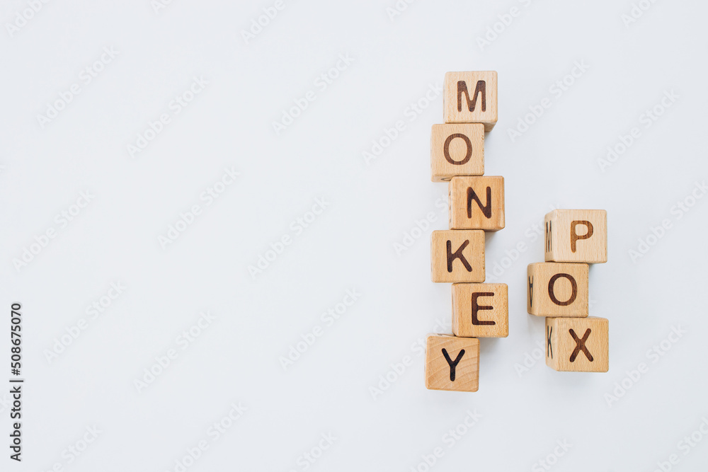 MONKEYPOX. Word written on square wooden tiles with an white background ...