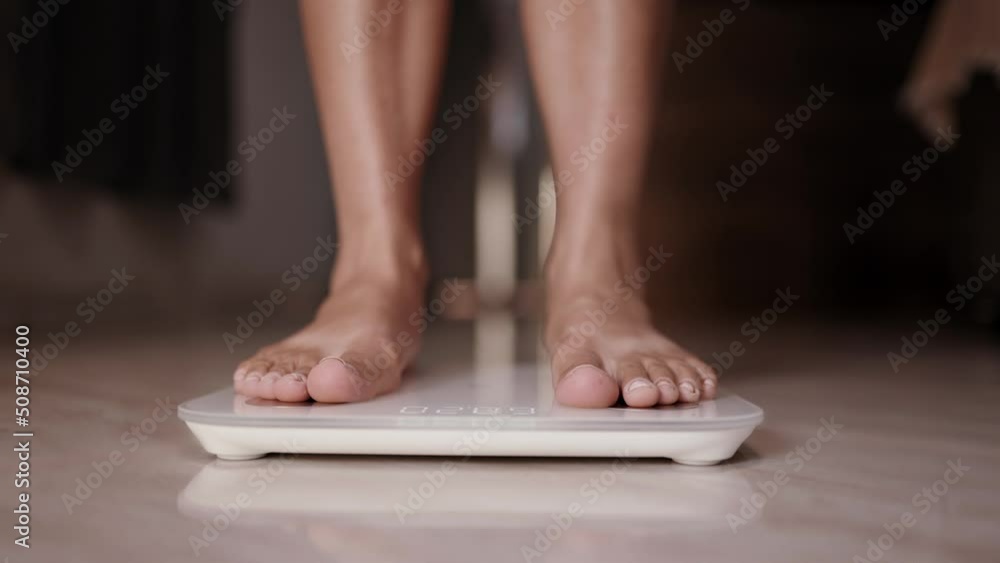 Woman on scales measure weight. girl legs step bathroom scale. Fitness ...