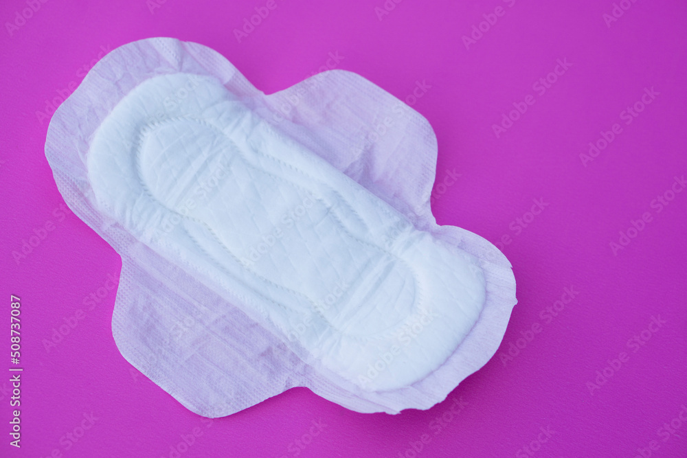 White sanitary pad on pink background. Concept: female's hygienic ...
