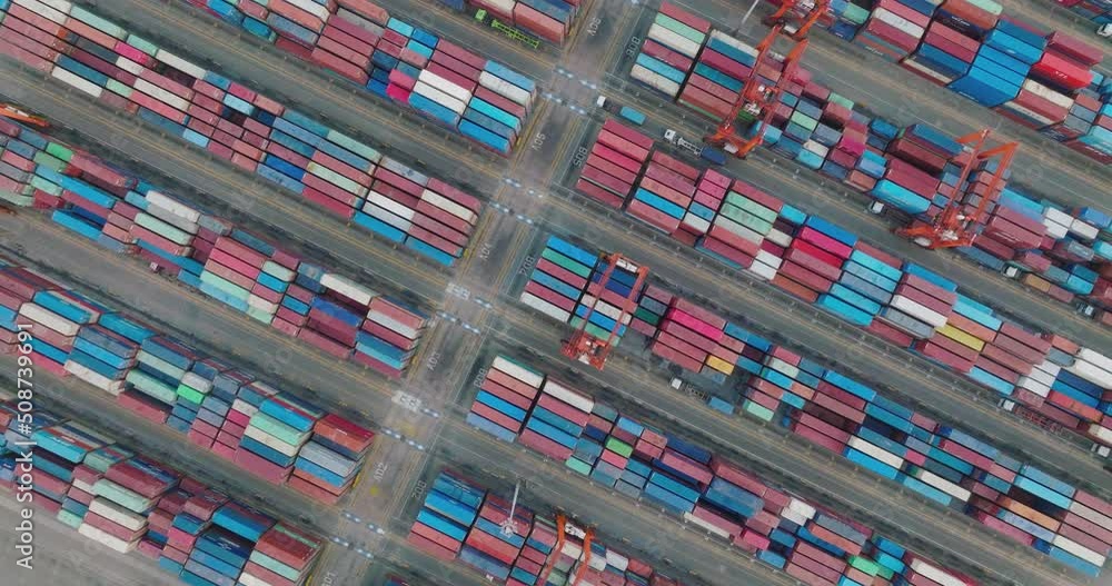 Aerial topdown view of shipping containers waiting on the docks to be ...