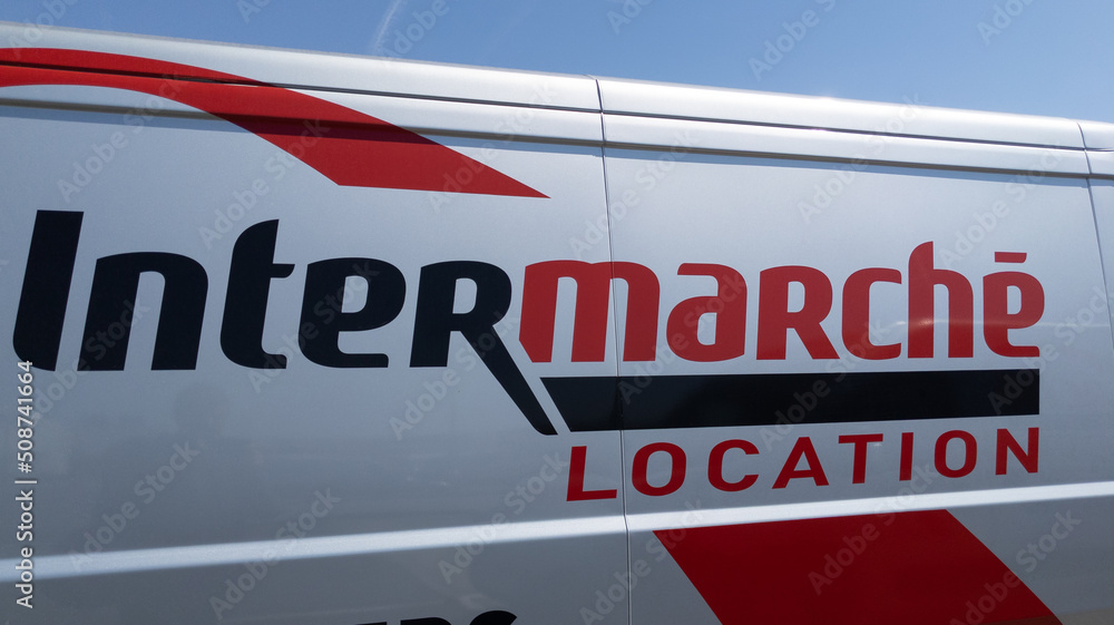 intermarche location sign logo on panel side van rental trucks front of ...