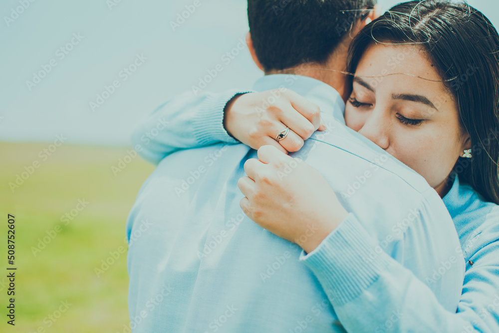 Concept of a couple lovingly embracing each other in the field, Close ...