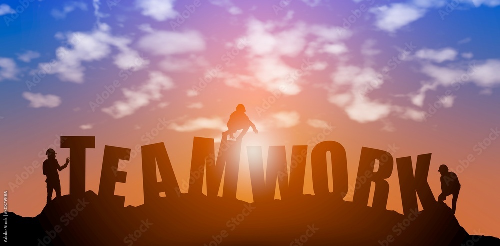 Silhouette of team work making teamwork words in sunset sky background ...