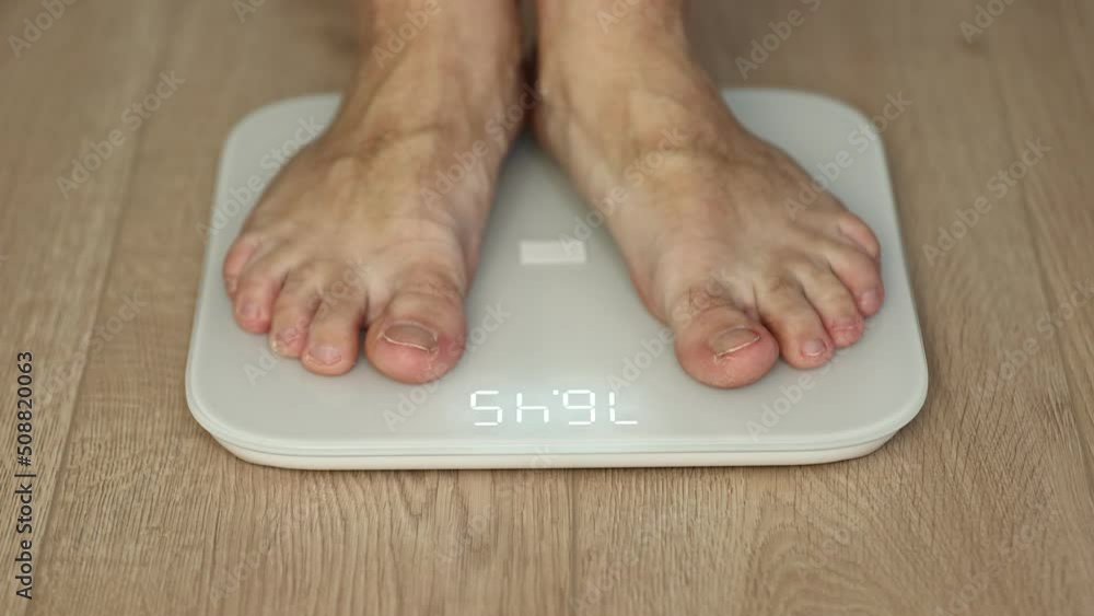 Walking Male Checking BMI Weight Loss. Human Barefoot Measuring Body ...